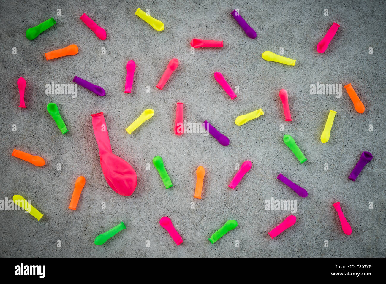 Colorful balloons on concrete surface. Party background Stock Photo - Alamy