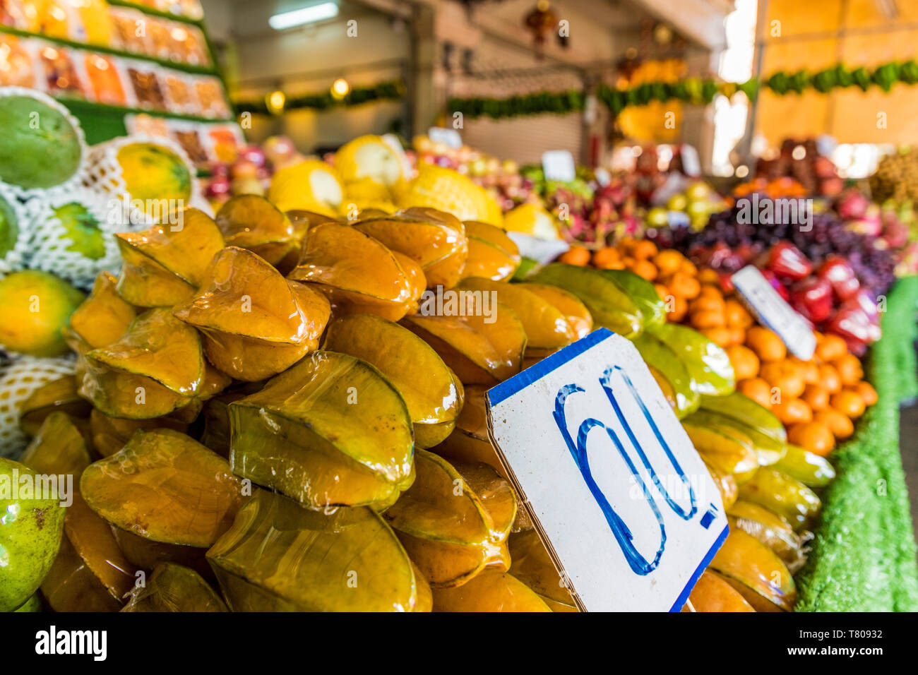 A market stall selling fruit, including Star fruit in Phuket Old Town ...
