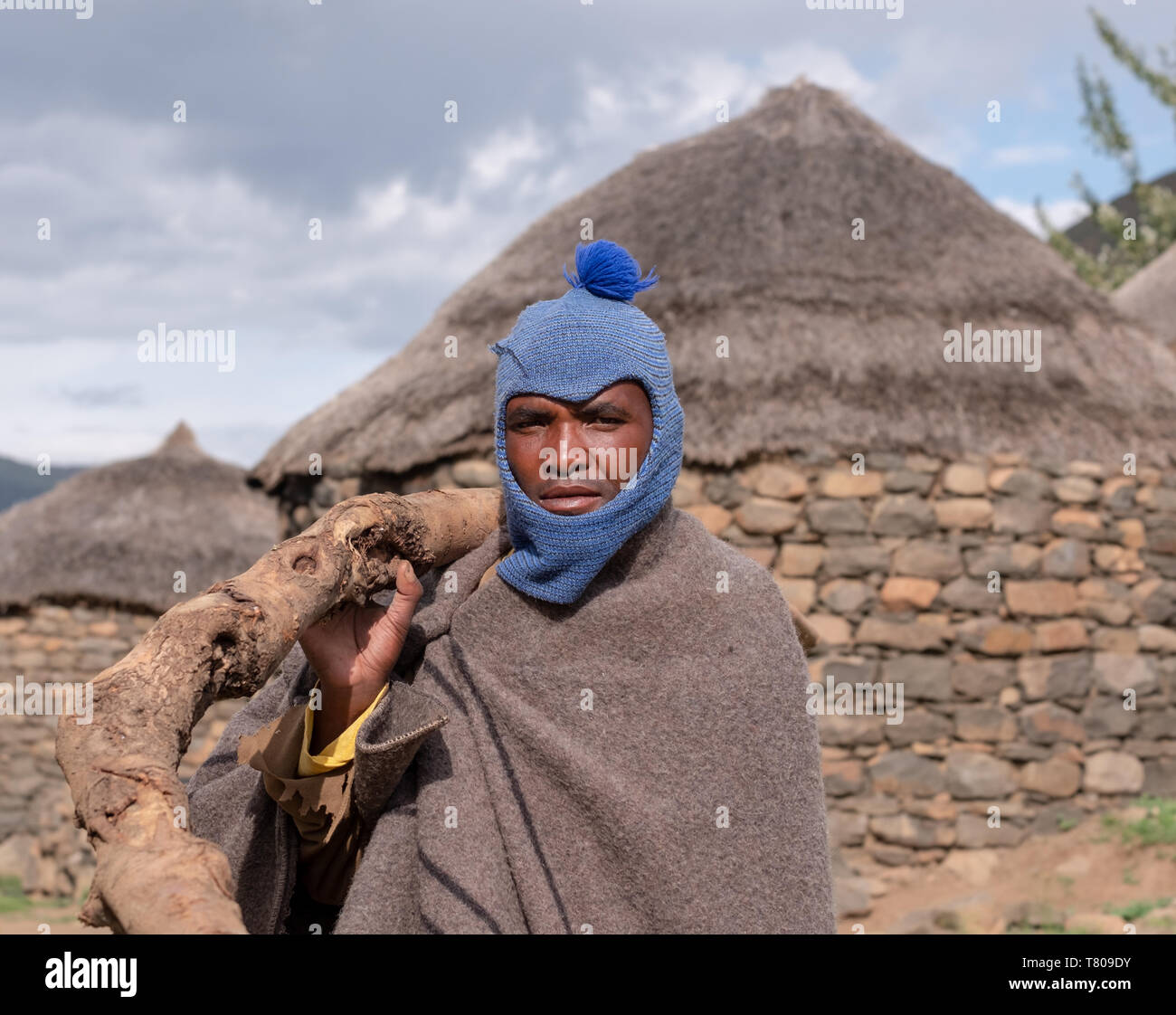 Shepherd wearing a blanket against the cold, in a mountain village near ...