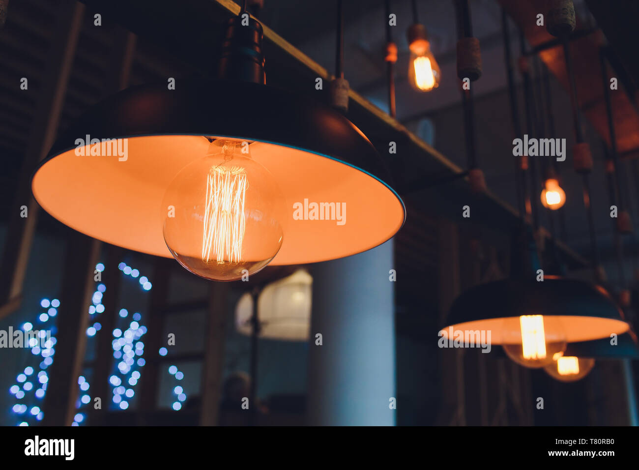 Hanging copper lights hi-res stock photography and images - Alamy
