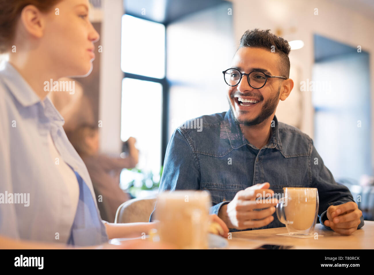 Laughing during conversation Stock Photo - Alamy