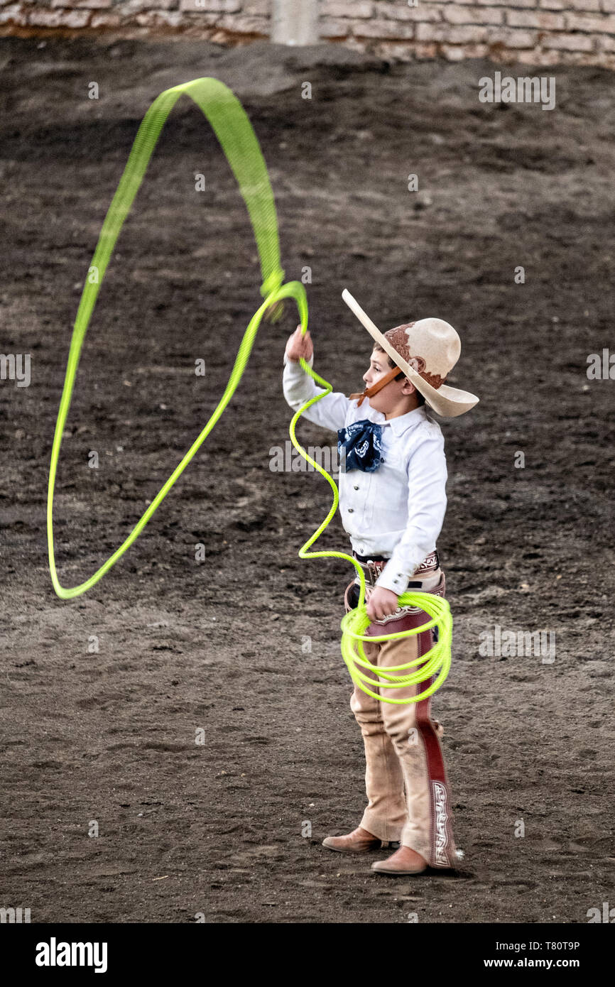 A young member of the Franco family practices his rope skills during ...