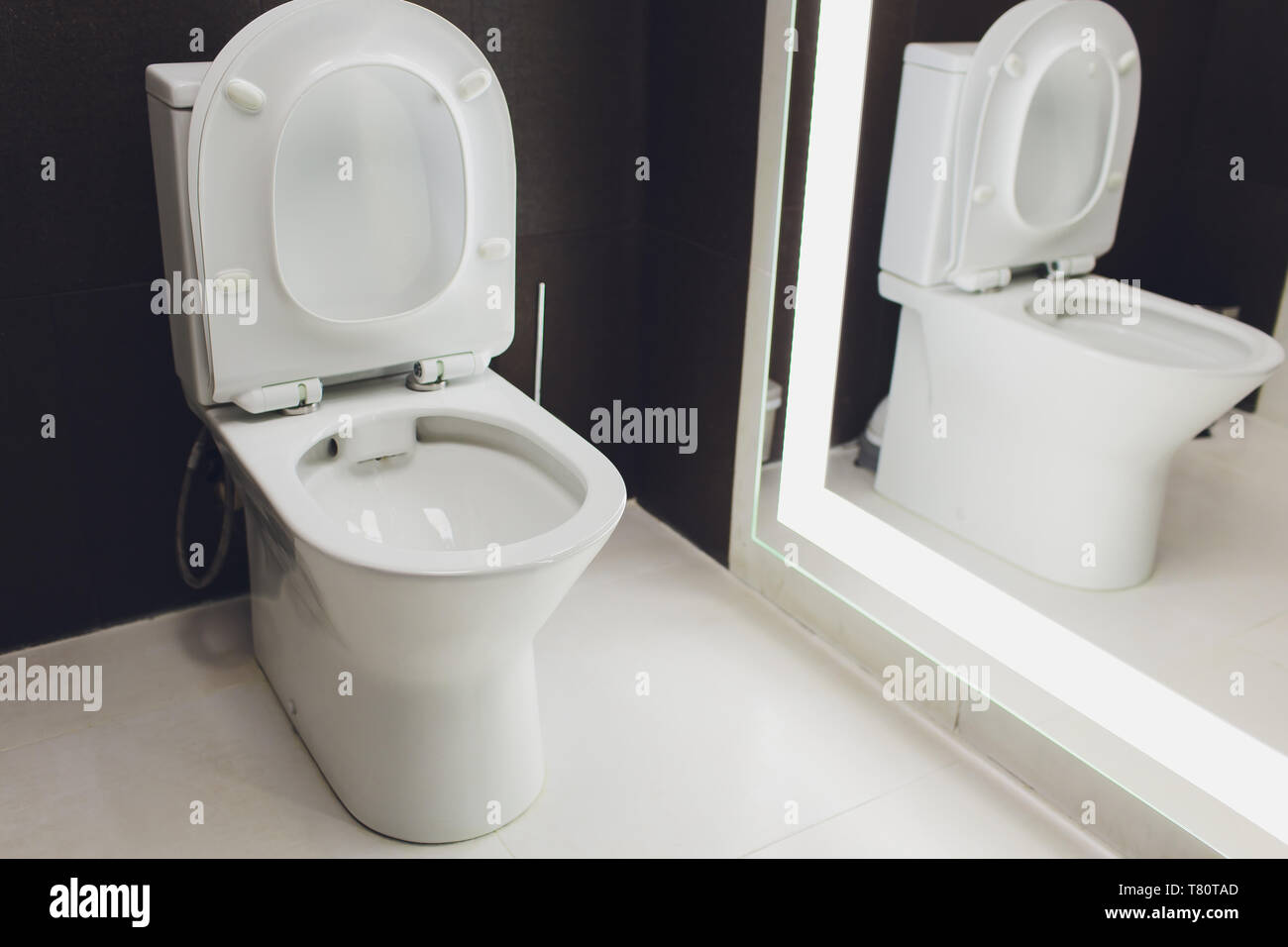 Toilet that Glows in a Standard Modern Bathroom Stock Photo - Alamy