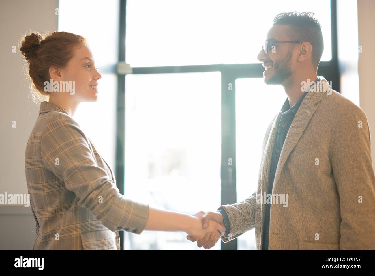 Greeting by handshake Stock Photo - Alamy