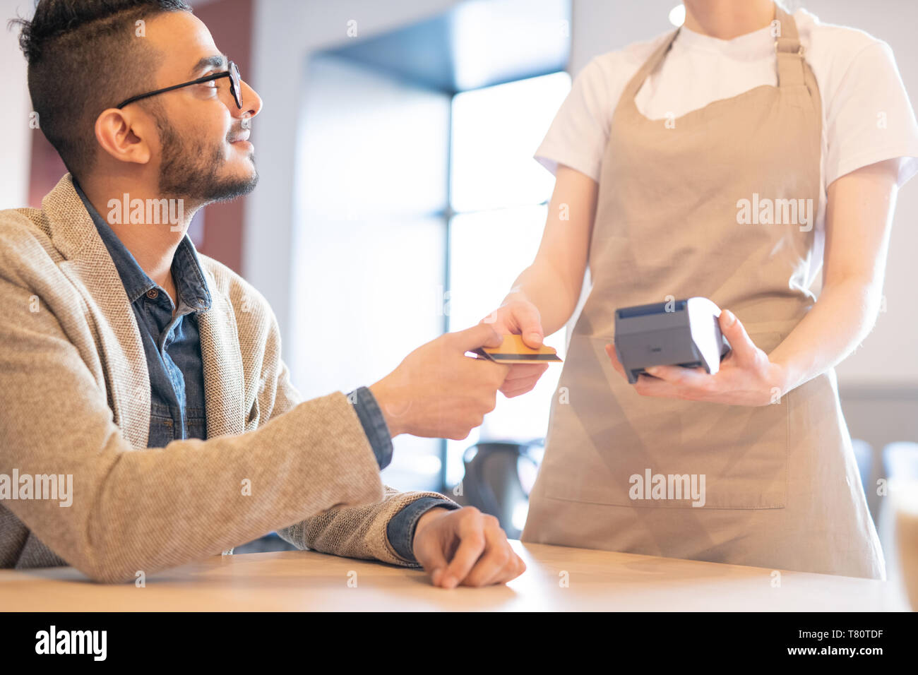Paying by credit card Stock Photo - Alamy