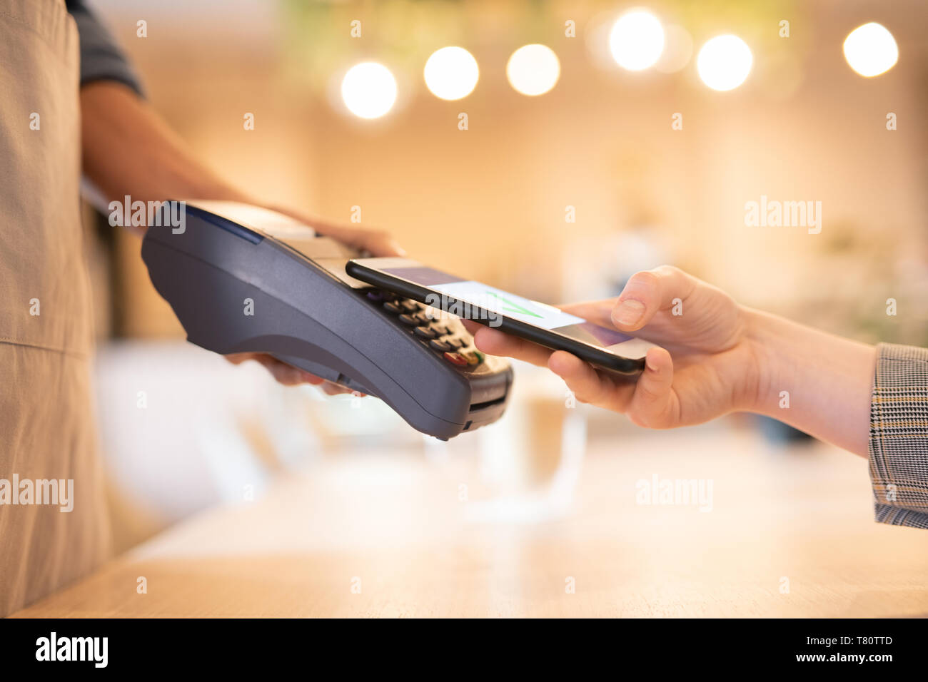 Using smartphone for payment Stock Photo - Alamy
