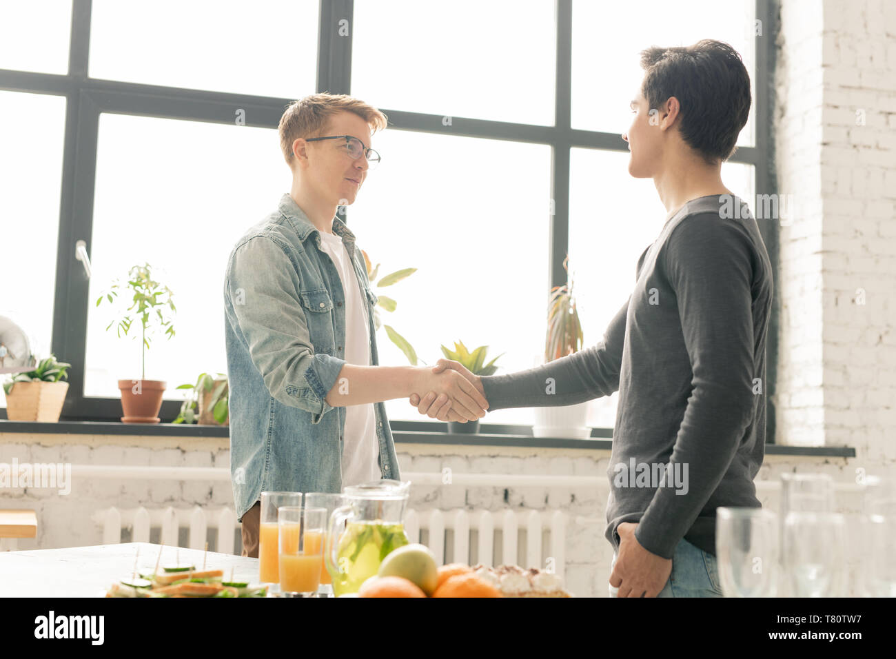 Party man handshake hi-res stock photography and images - Alamy