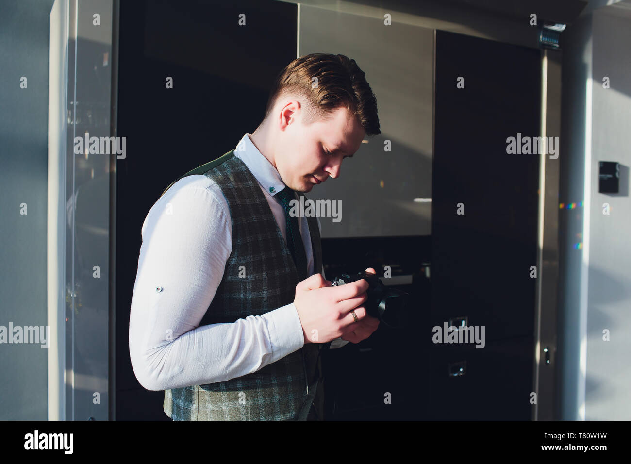 Man holding photo camera in hand outdoor, photographer concept ...
