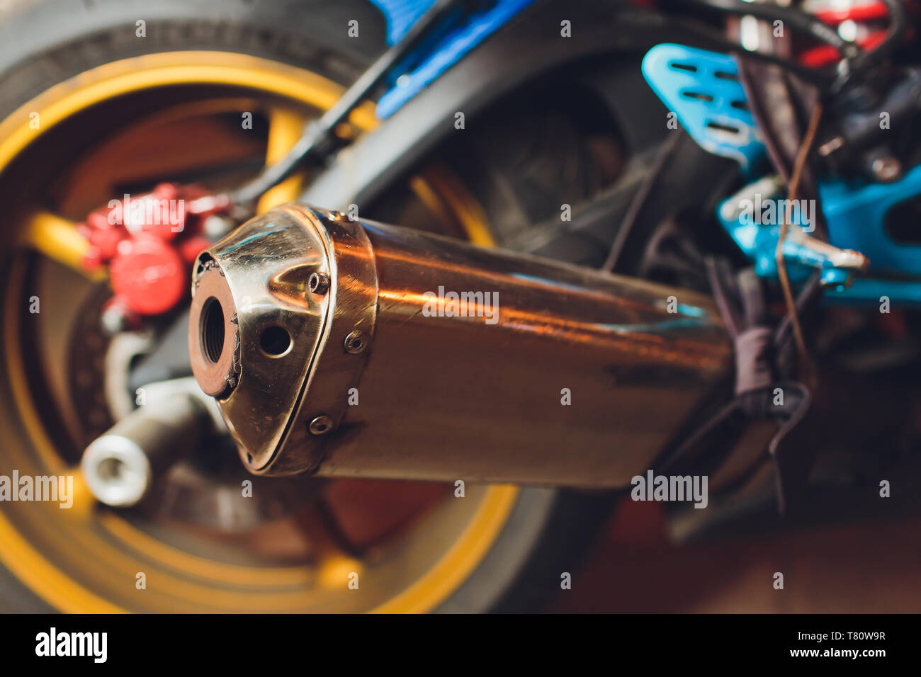 rear view of classical motorcycle pair of exhaust chrome pipes ...