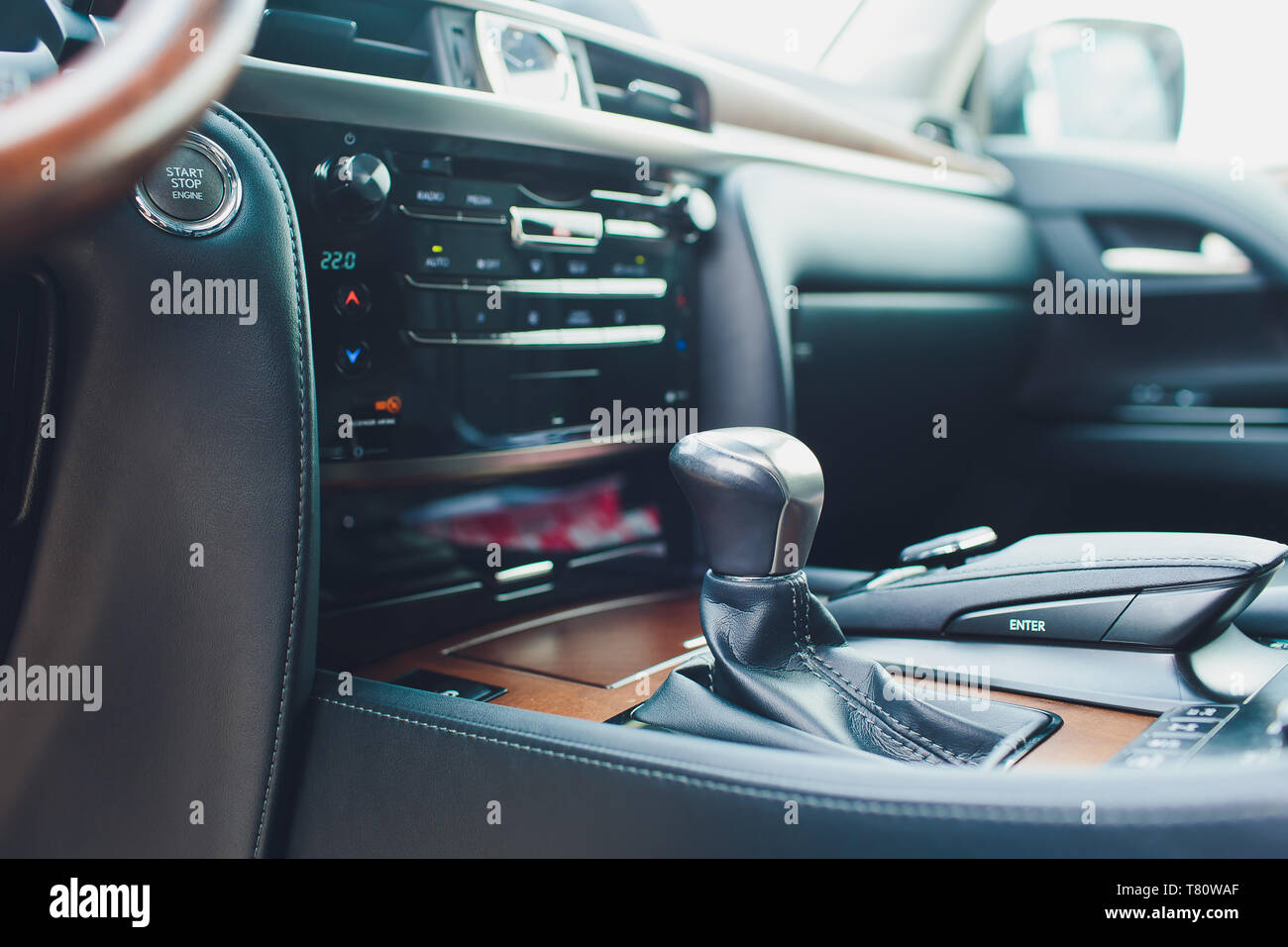 Luxury car interior. Steering wheel, shift lever and dashboard Stock ...