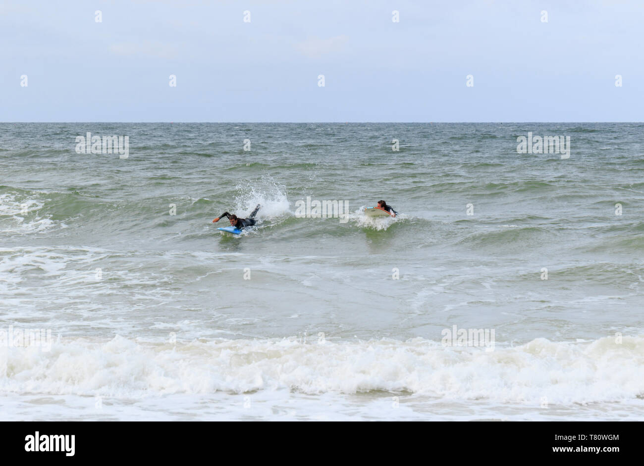 Two man surfing board hi-res stock photography and images - Alamy