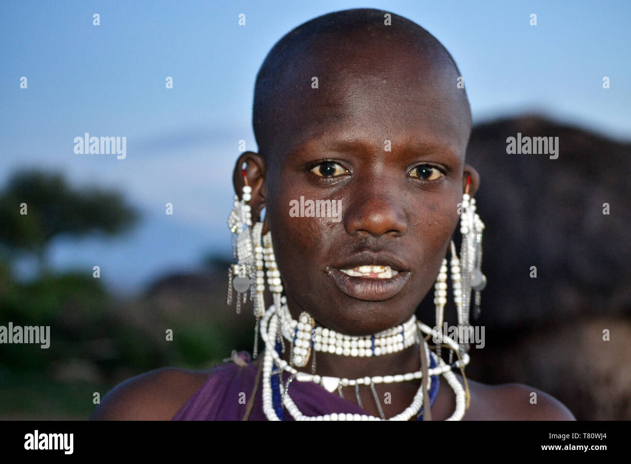 Portrait of Maasai girl in natural reserve of Ngorongoro Conservation ...