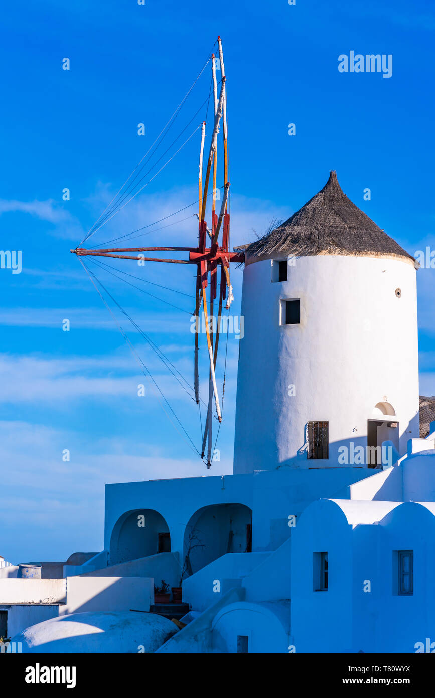 Traditional white windmill in Oia on Cyclades island of Santorini ...