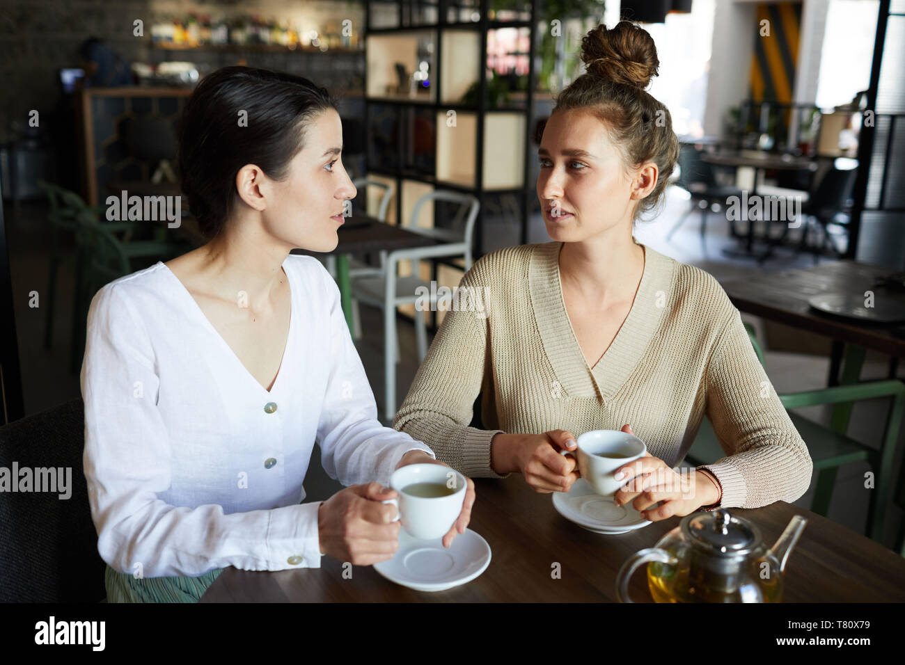 Girls in cafe Stock Photo - Alamy