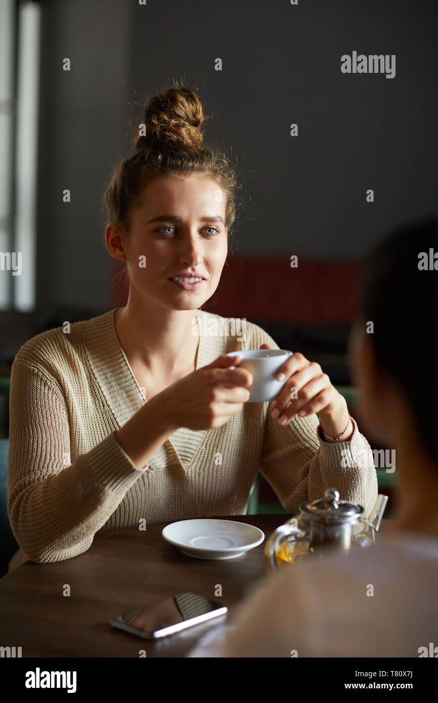 Talking by cup of tea Stock Photo - Alamy
