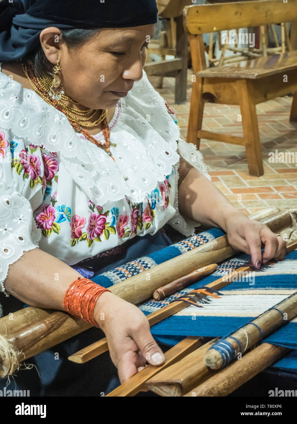 Indigenous woman weaving with backstrap loom, Otavalo, Ecuador, South ...