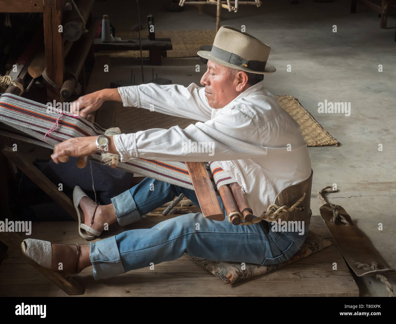 Indigenous man weaving with a backstrap loom, Otavalo, Ecuador, South ...