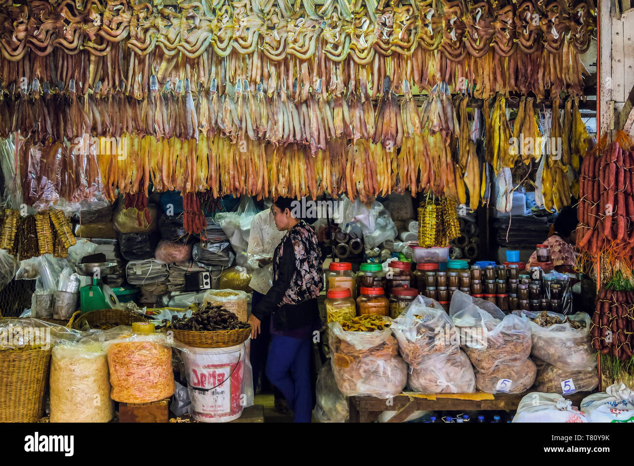 Smoked fish hanging at stall in the Psar Chas Old Market in the centre ...