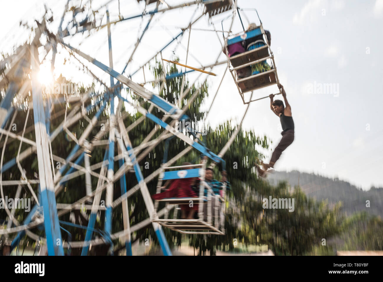 Hand operated ferris wheel at Pindaya Cave Festival, Shan State ...