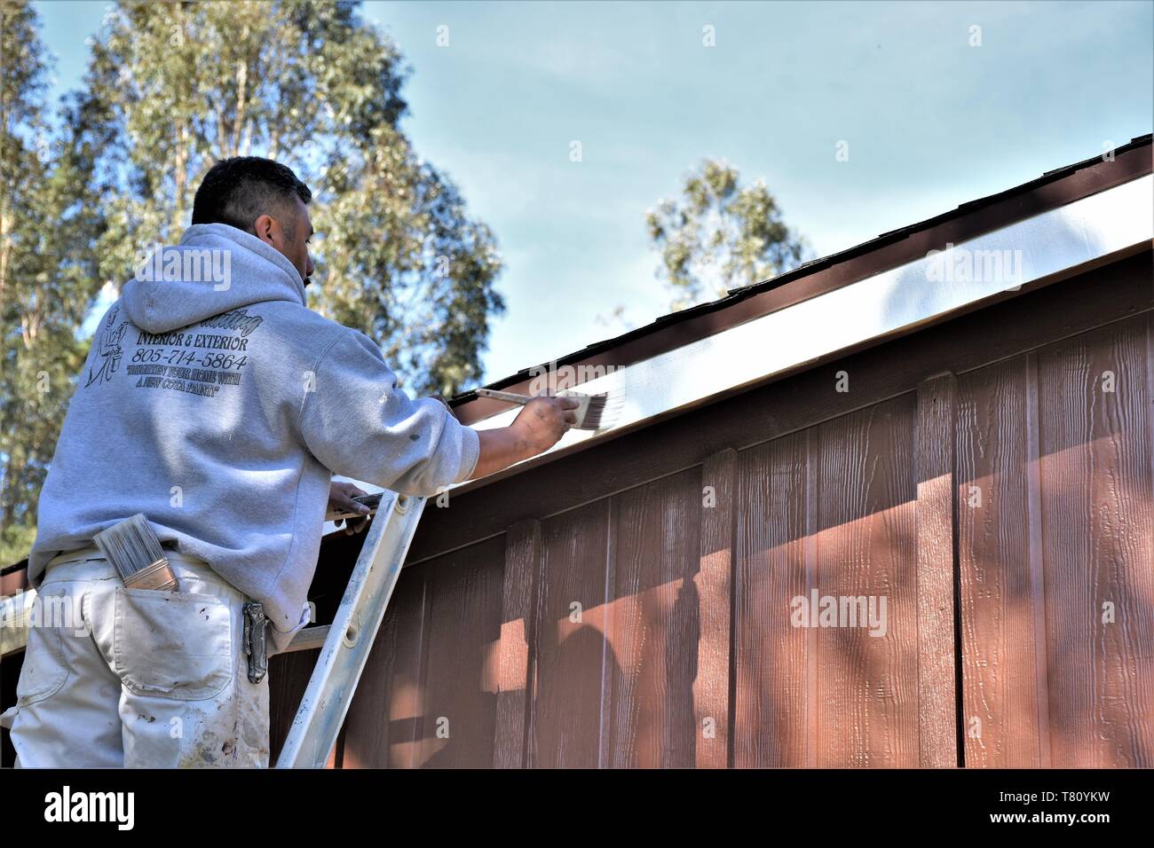 Hispanic Mexican painter working on new construction in California ...