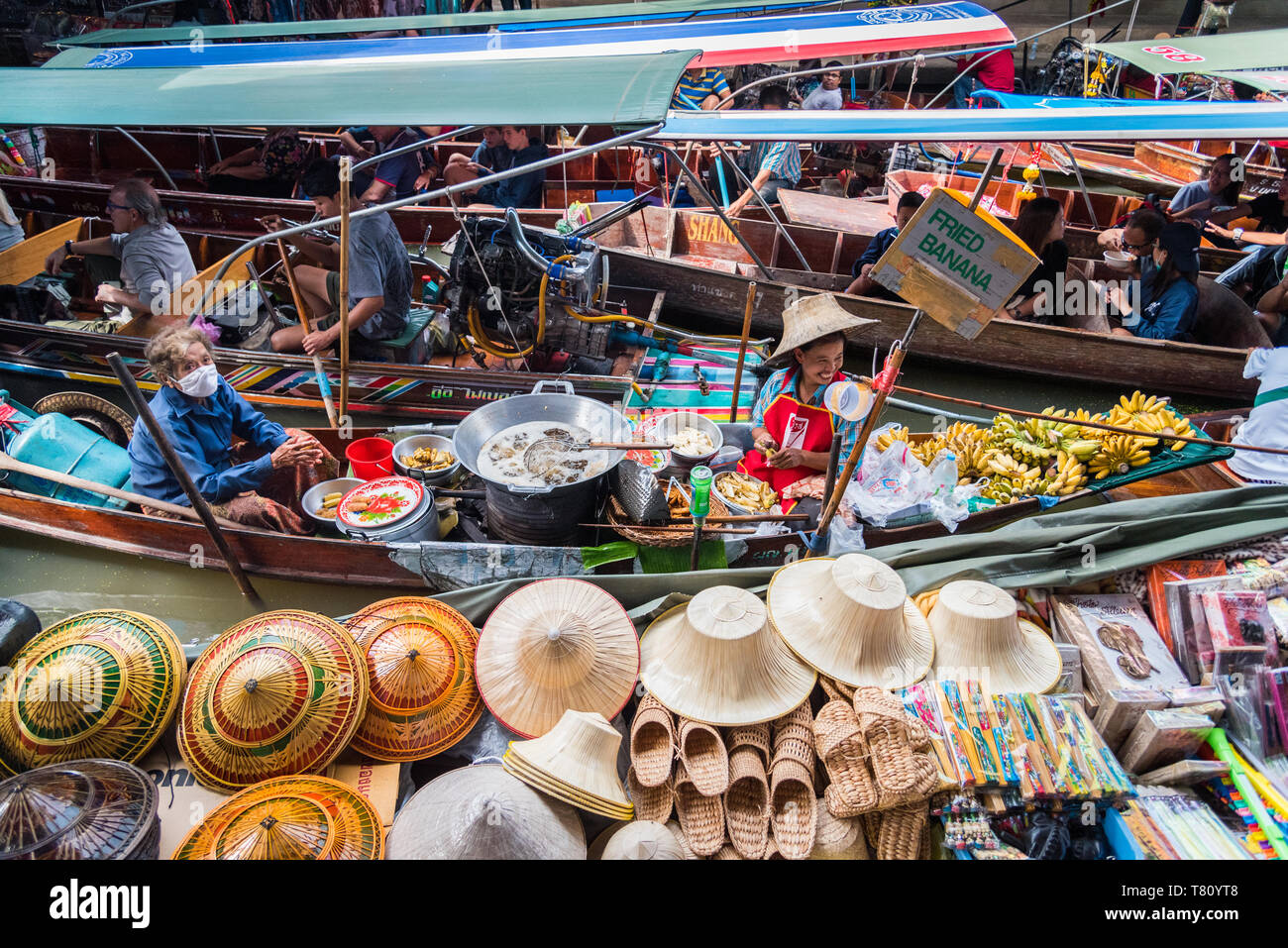 Ladies selling fried bananas at The Damnoen Saduak Floating River ...