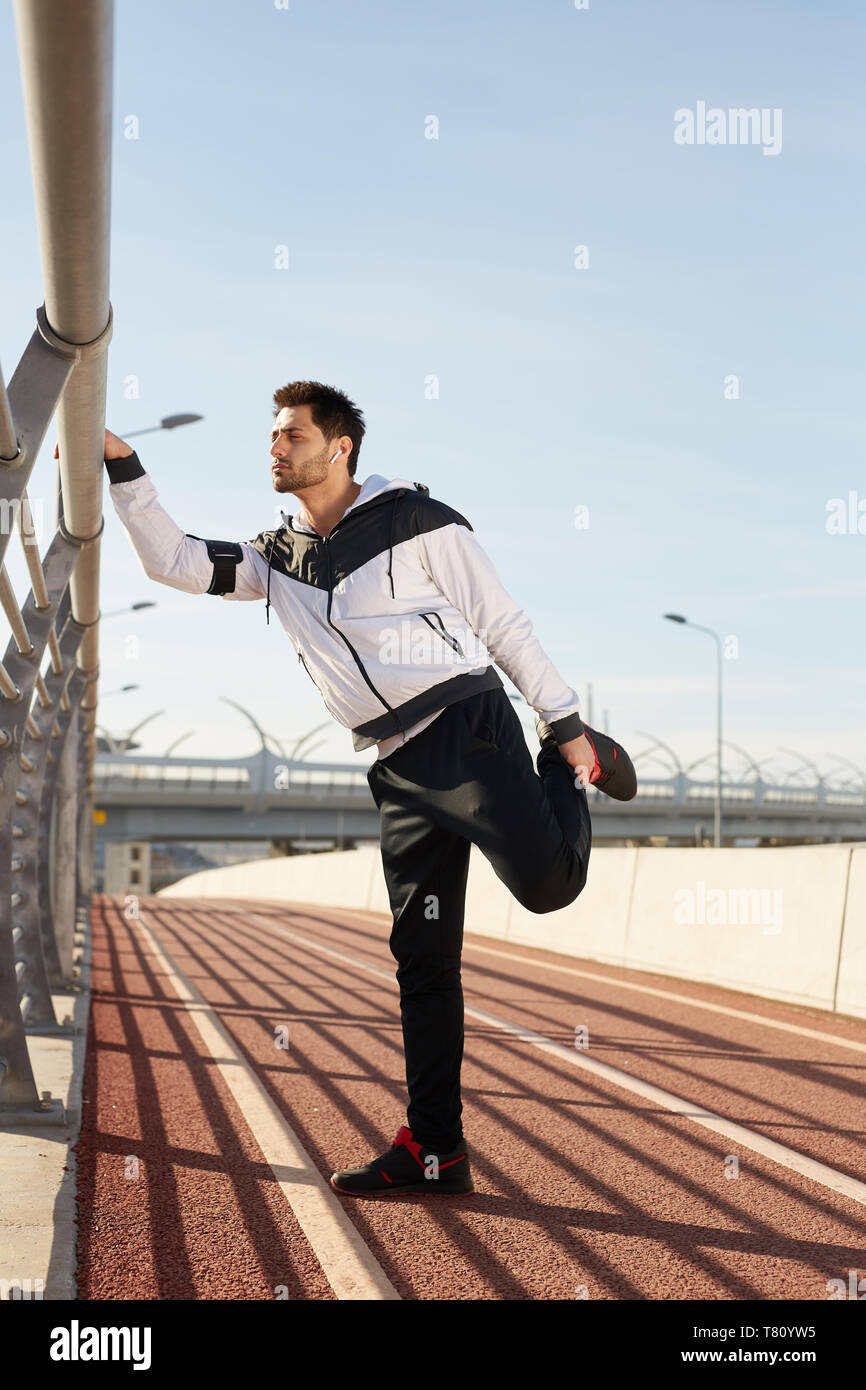 Man stretching by the riverside hi-res stock photography and images - Alamy
