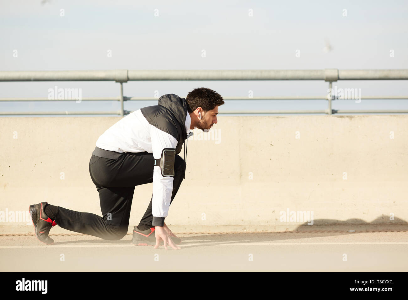 Runner by start line Stock Photo - Alamy