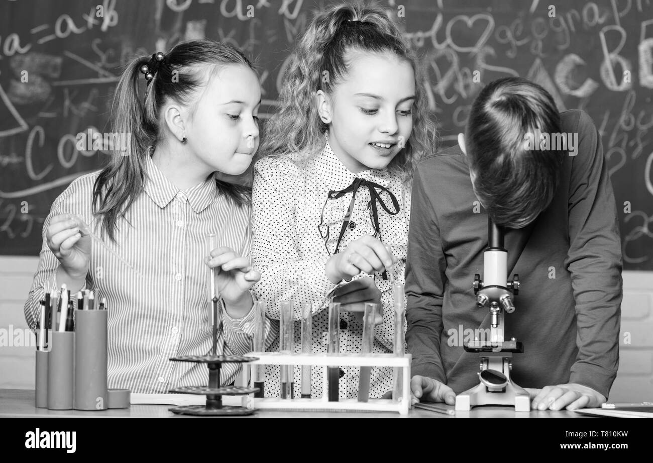 Little kids scientist earning chemistry in school lab. Little children ...