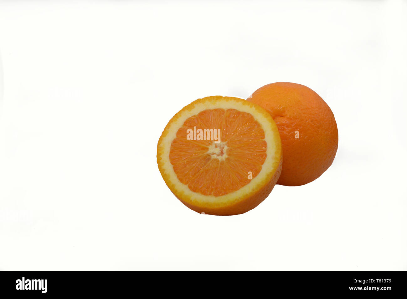 half ripe orange fruit useful on an isolated white background Stock ...
