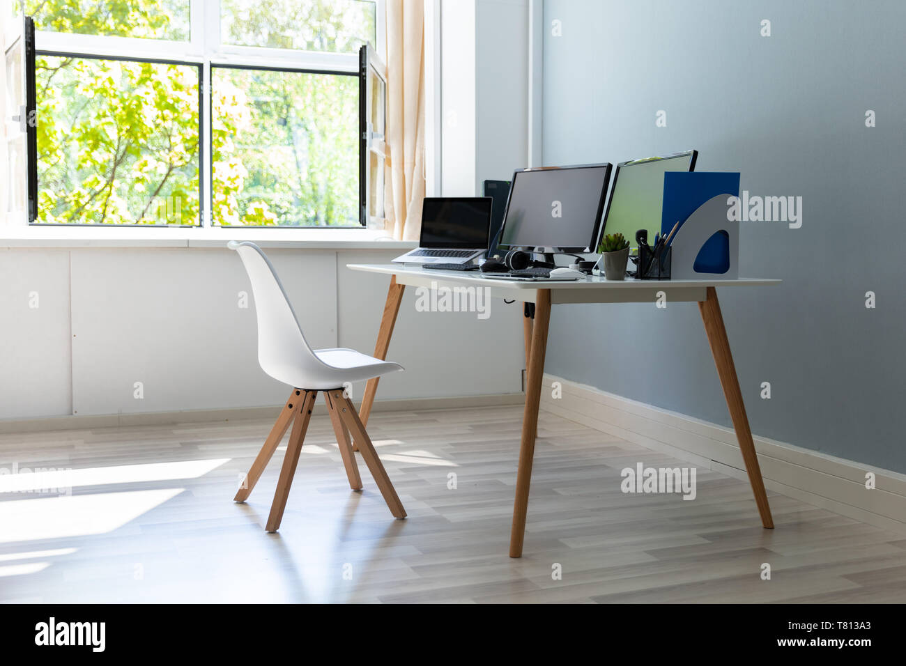 Computer On Desk In Modern Interior Office Stock Photo - Alamy