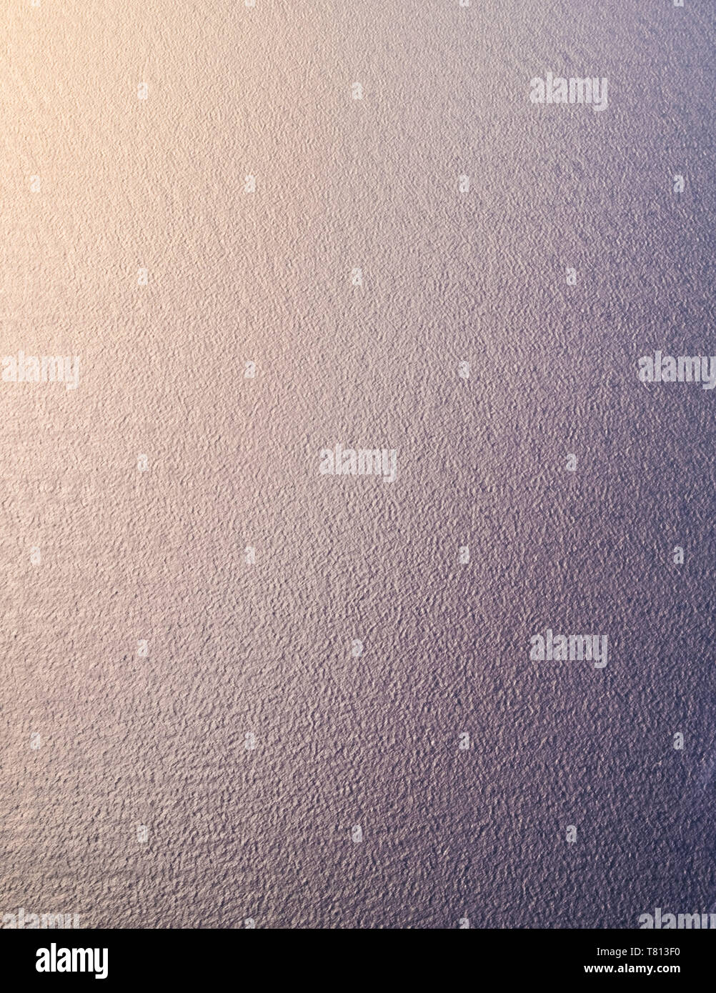 Aerial view of water in the ocean, gradient light and rippled texture ...