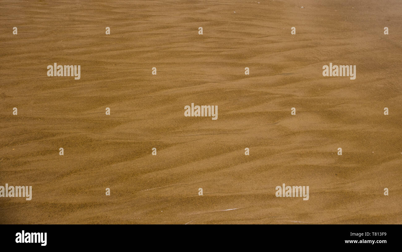 Sand pattern, background. Photo of wet sand on the beach Stock Photo ...