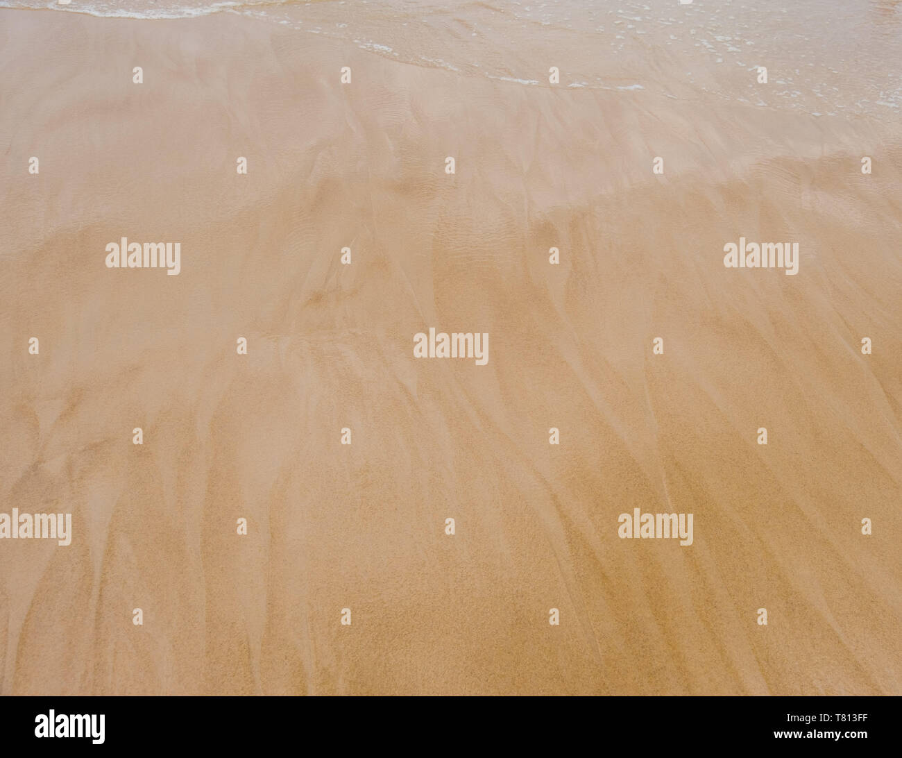 Sand pattern, background. Photo of wet sand on the beach Stock Photo ...