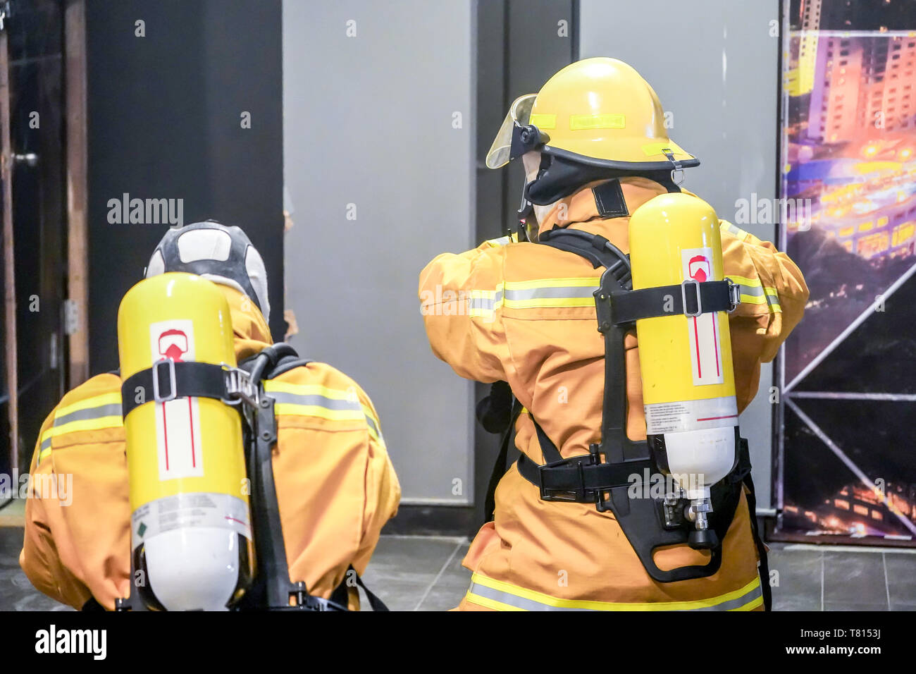 Fireman on duty with their yellow uniform Stock Photo - Alamy