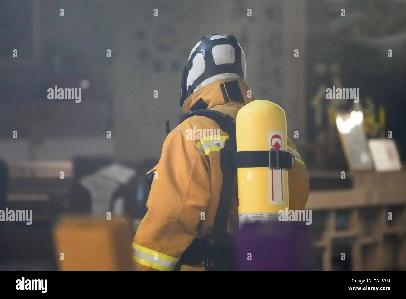 Fireman on duty with their yellow uniform Stock Photo - Alamy