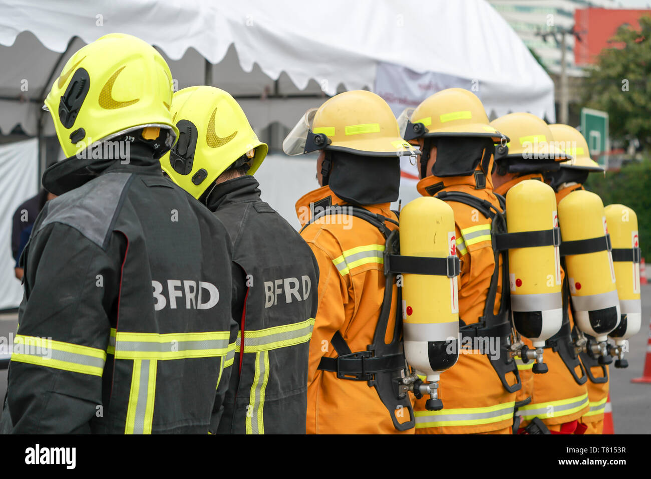 Fireman on duty with their yellow uniform Stock Photo - Alamy
