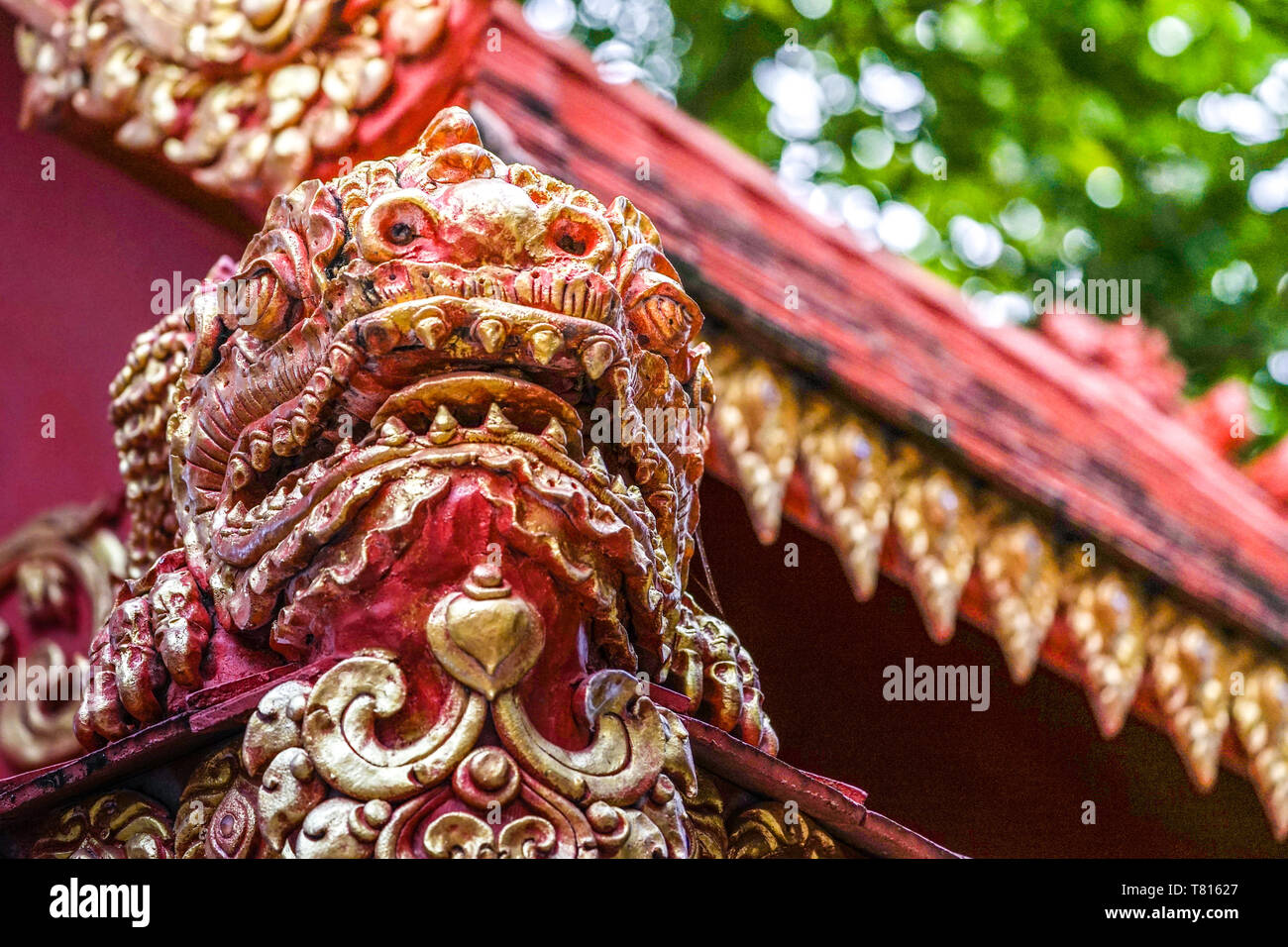 Red gold Asia monster statue in north of Thai temple., Their ...