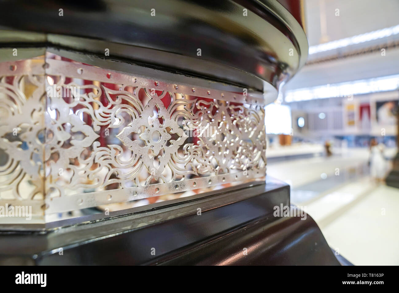 Thai silver pattern with mirror decoration inside black pole and blur ...