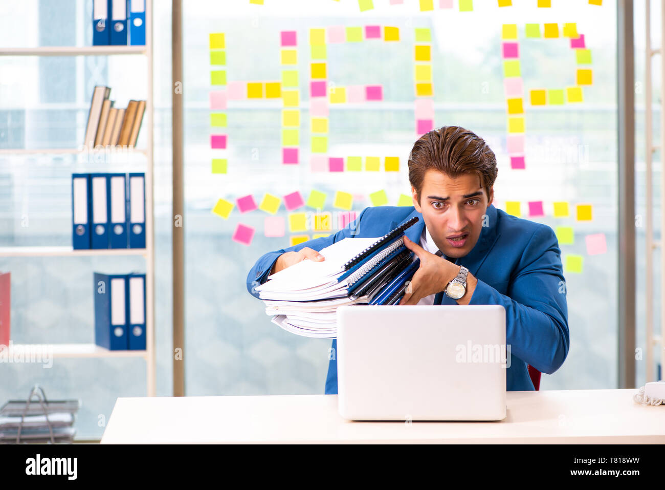 Busy businessman working in the office Stock Photo - Alamy