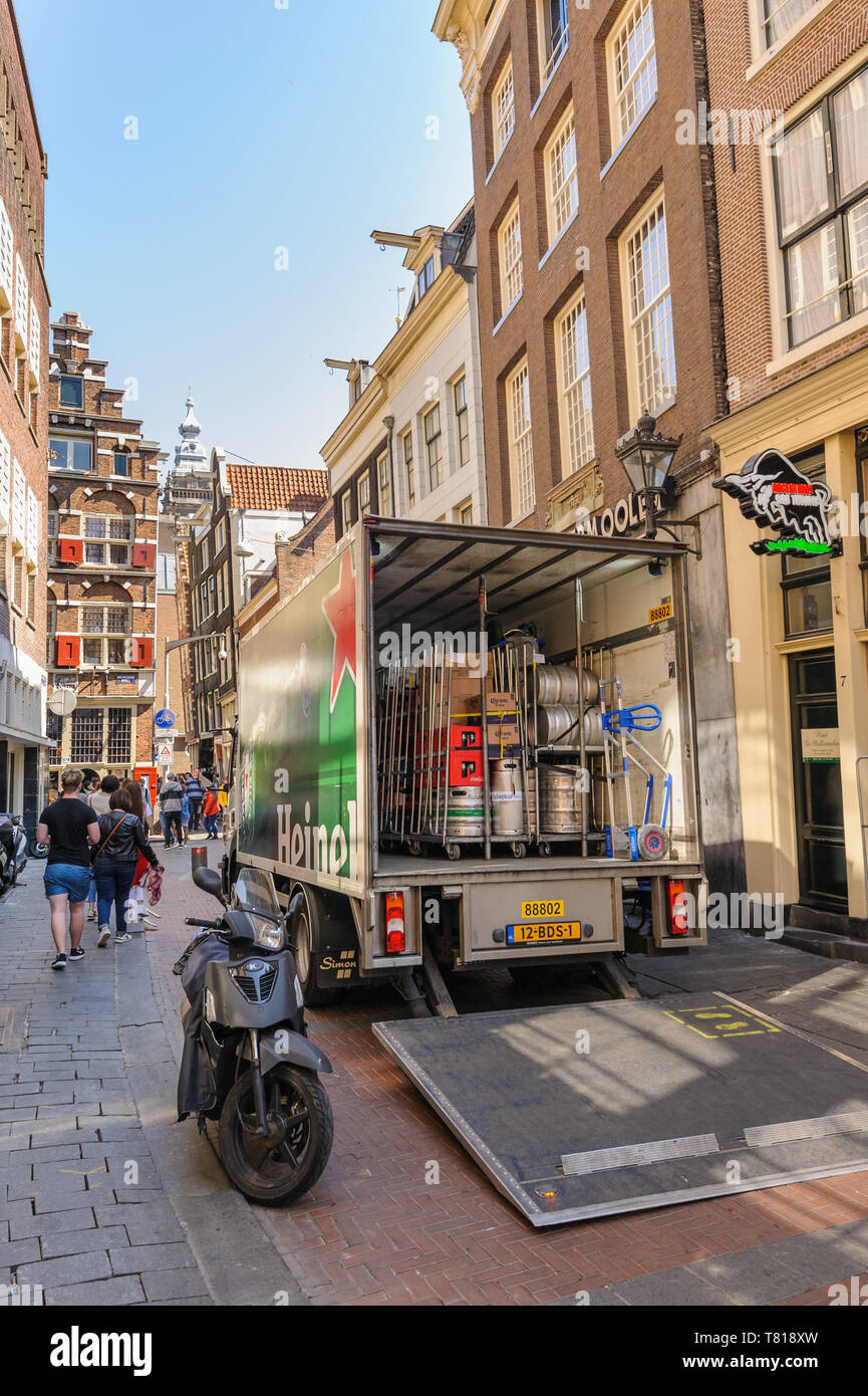 People at streets of Amsterdam during spring time Stock Photo - Alamy