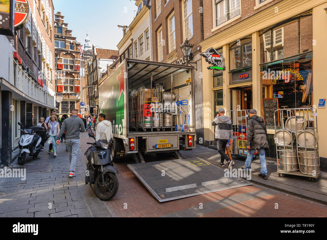 People at streets of Amsterdam during spring time Stock Photo - Alamy