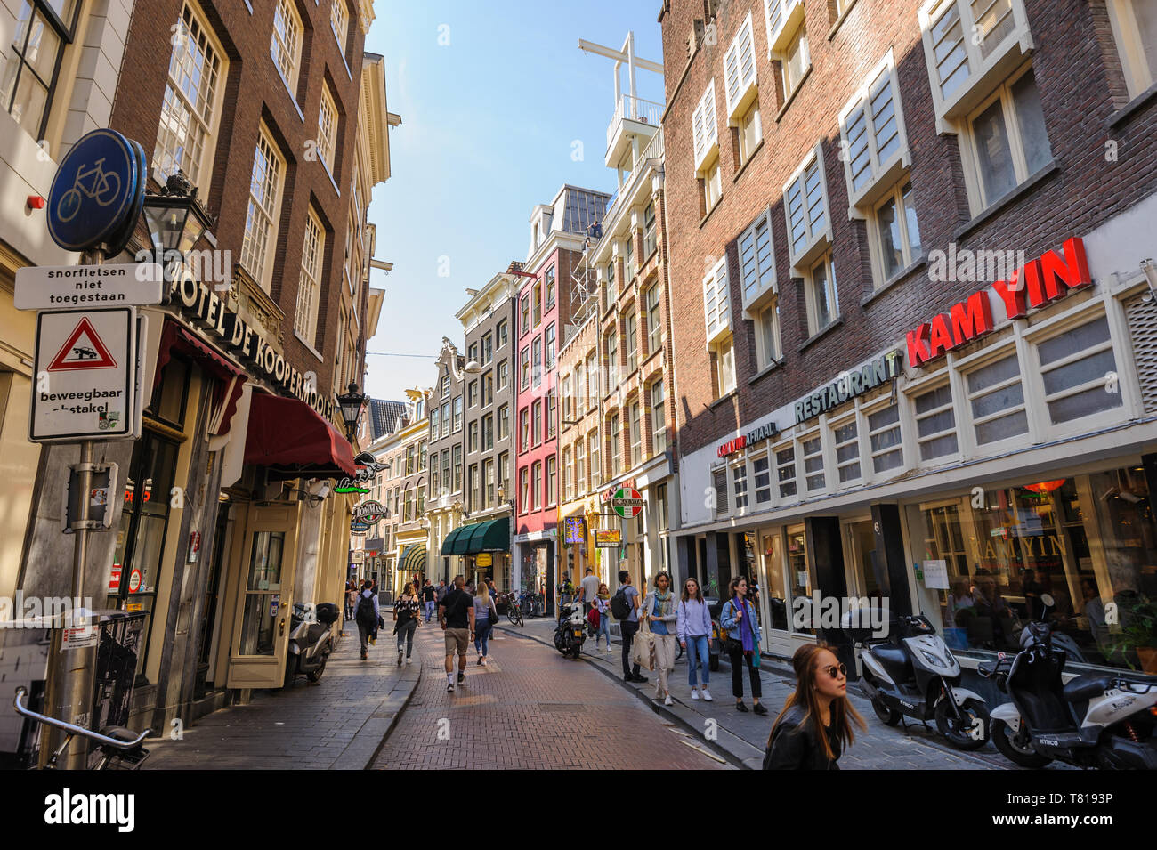 People at streets of Amsterdam during spring time Stock Photo - Alamy