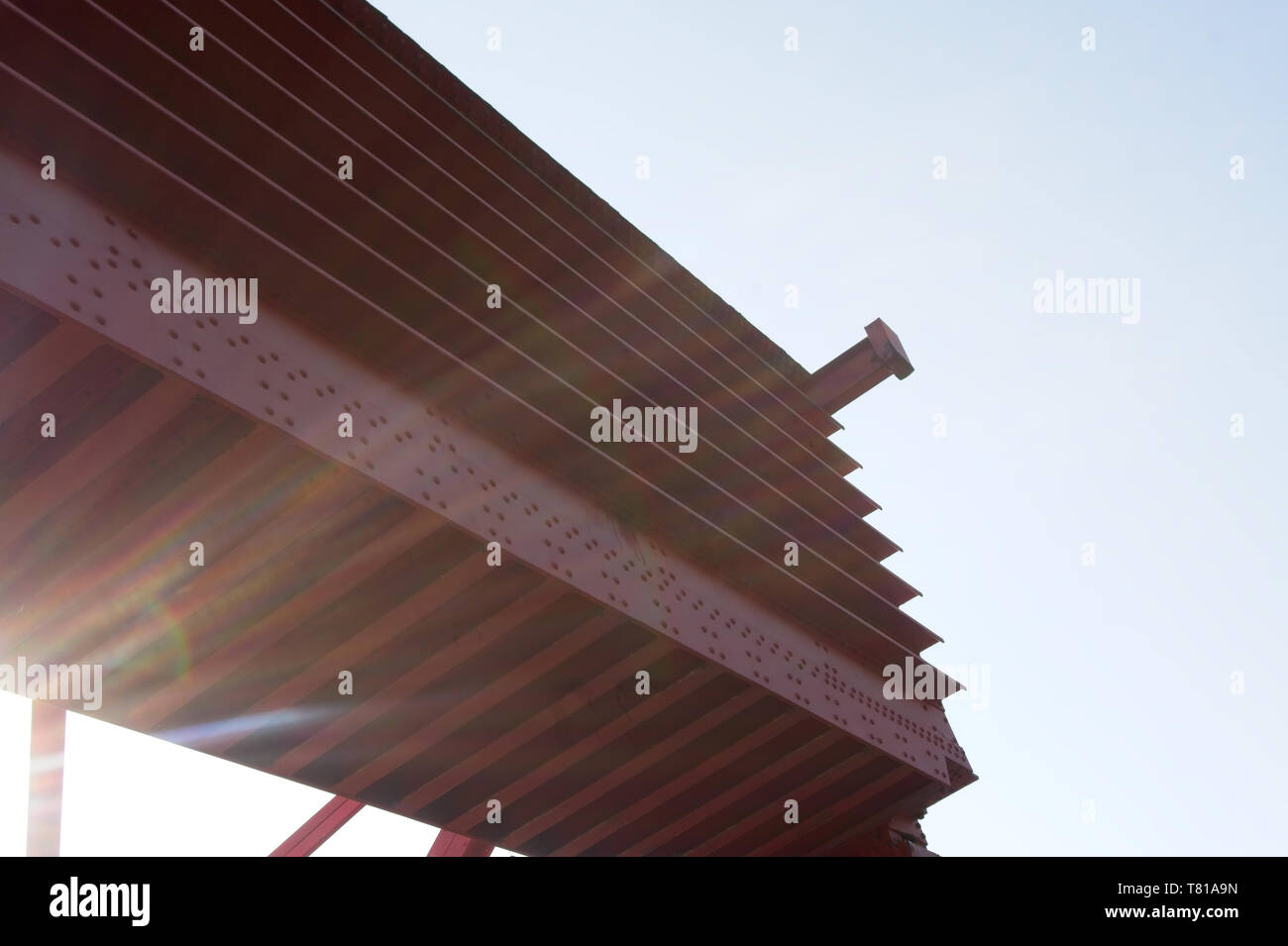 Low angle view of industrial old steel structure against sky. Abstract ...