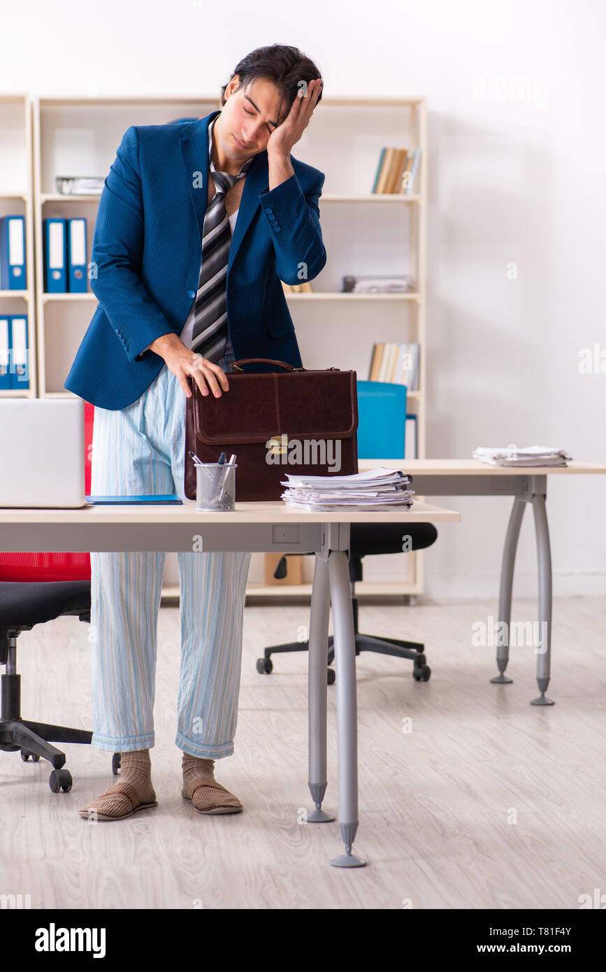 Employee coming to work straight from bed Stock Photo - Alamy