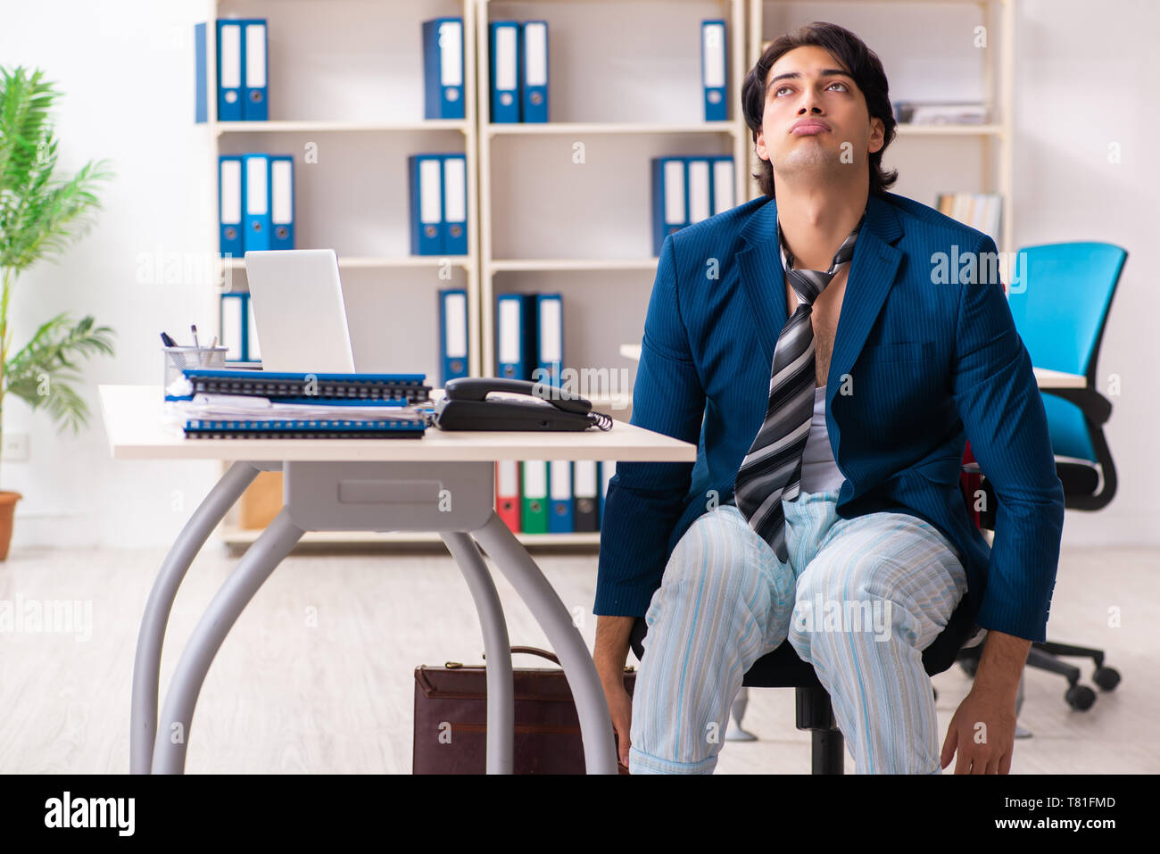Employee coming to work straight from bed Stock Photo - Alamy