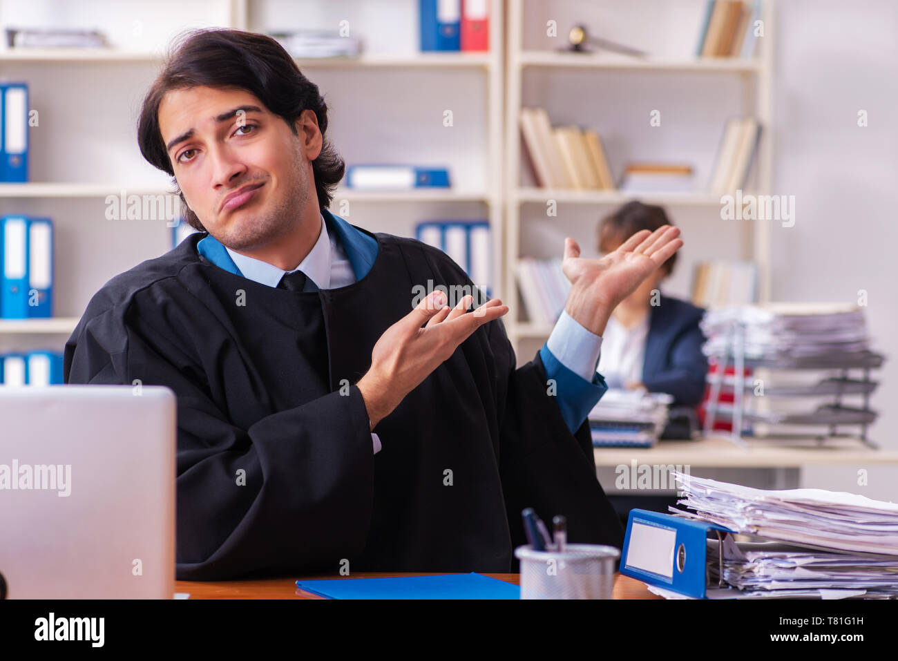 Two lawyers working in the office Stock Photo - Alamy