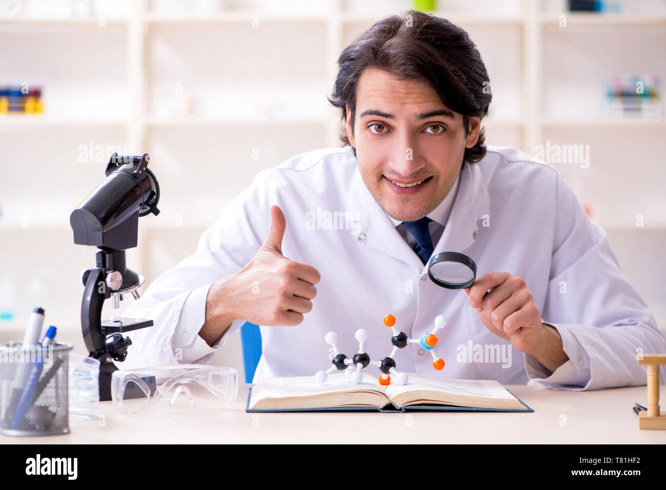 Young male scientist working in the lab Stock Photo - Alamy