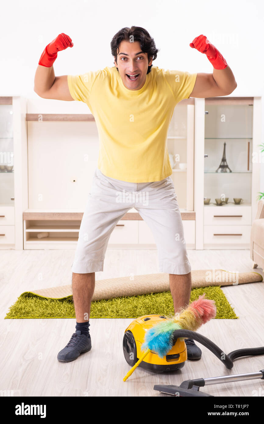 Young handsome man doing housework Stock Photo - Alamy