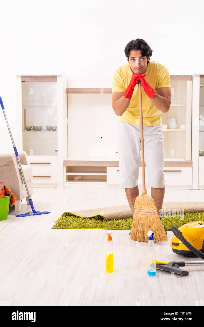 Young handsome man doing housework Stock Photo - Alamy