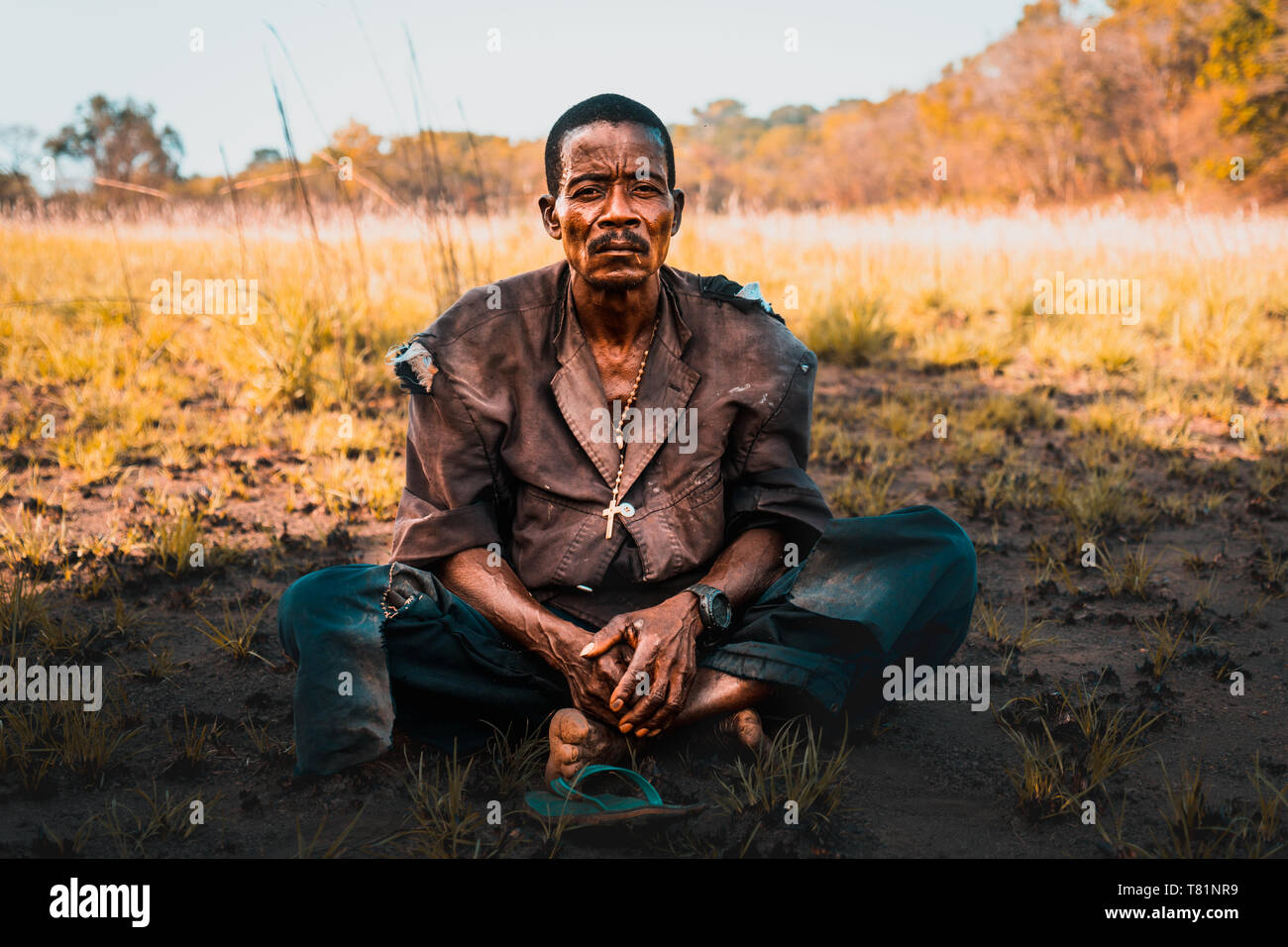 Poacher caught red handed by rangers in africa Stock Photo - Alamy